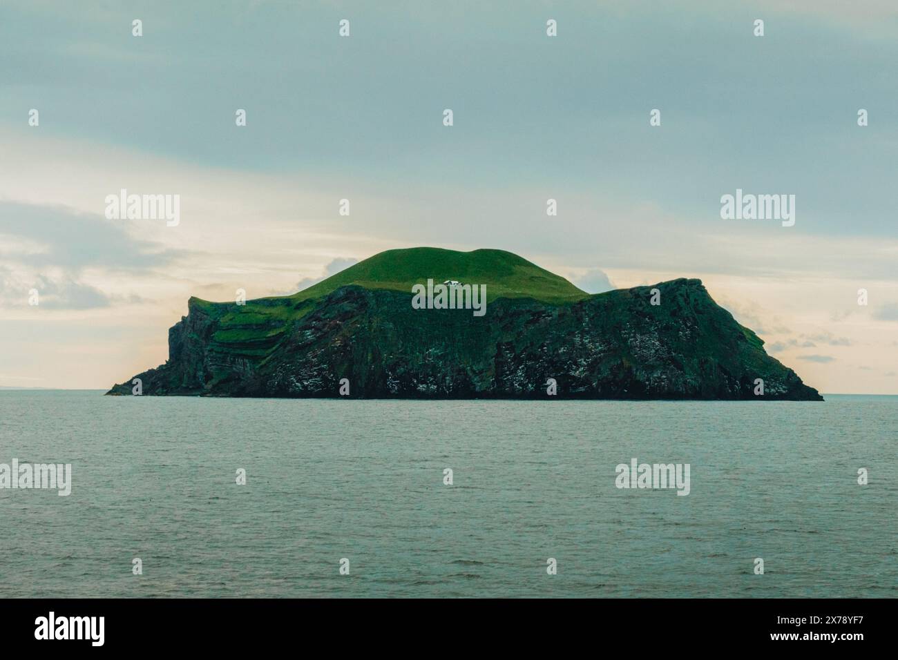 A scenic view of a small, isolated island in Vestmannaeyjar (Westman ...