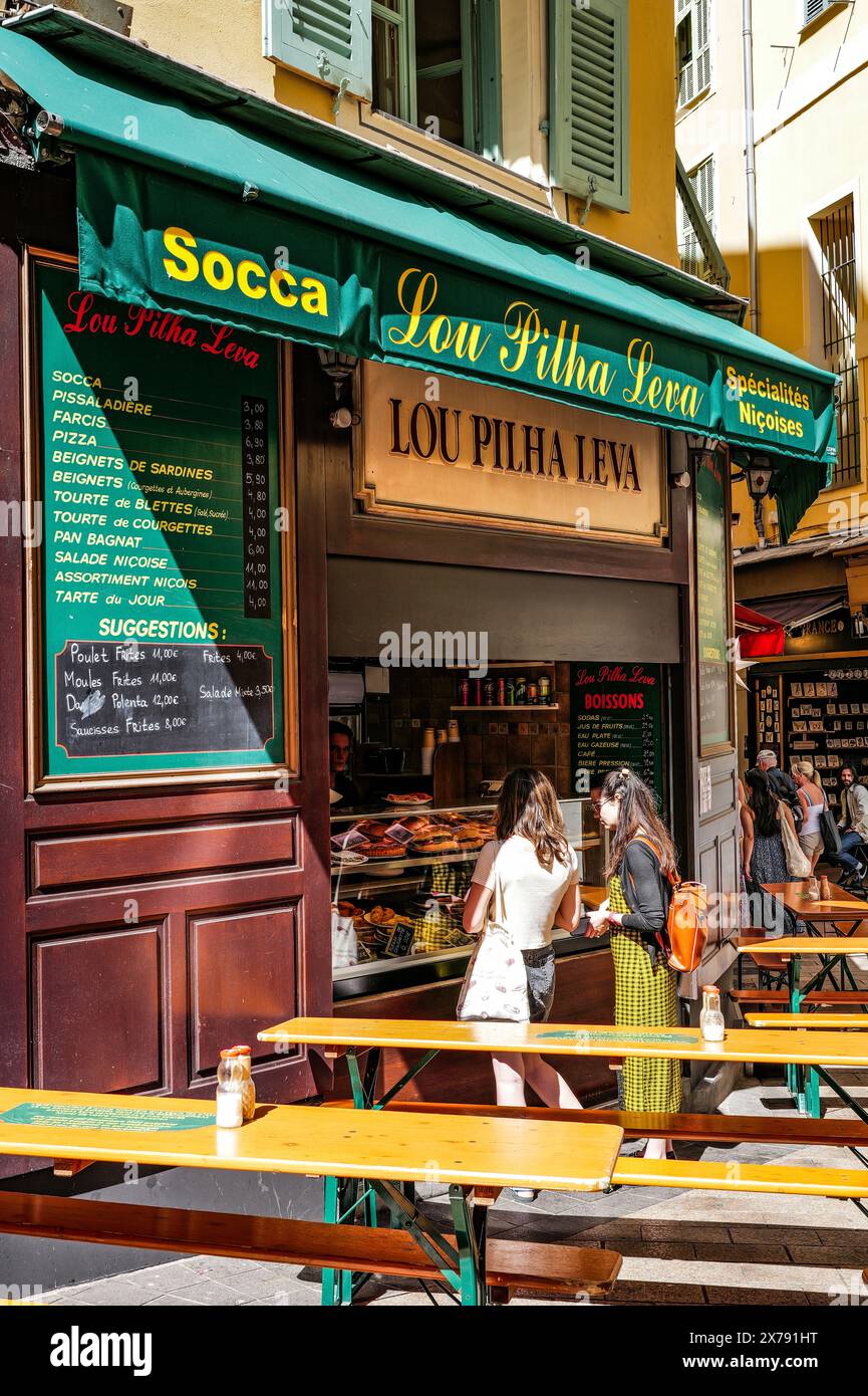 Nice, France. Socca takeaway stall in Old Town. . Socca is a a sort of ...