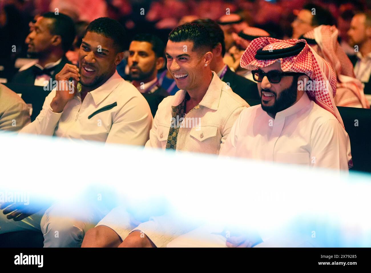 Anthony Joshua (left), Cristiano Ronaldo and Turki Al-Sheikh watch on ...