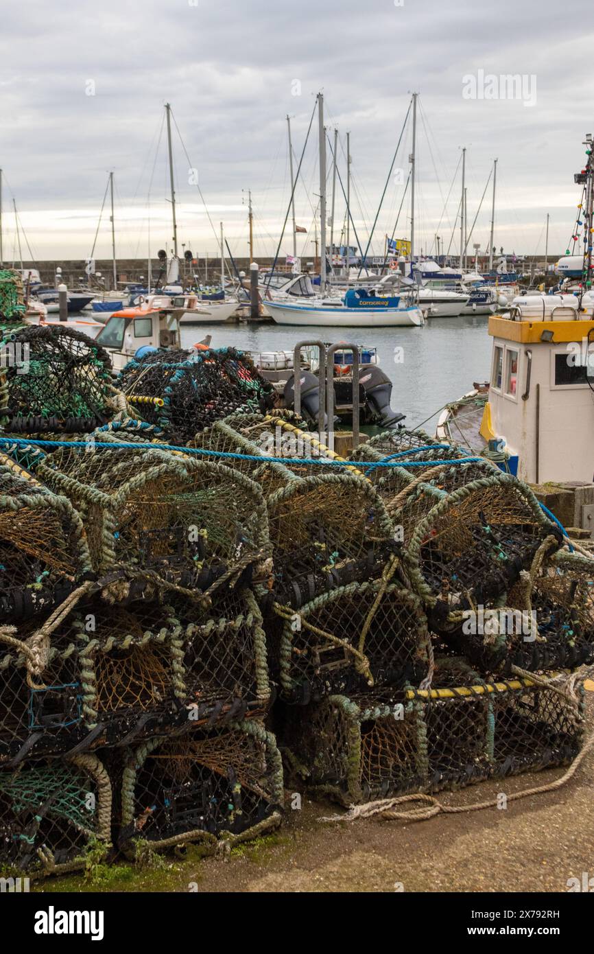 Catch of the day, lobster pots sitting on the seafront in the seaside ...