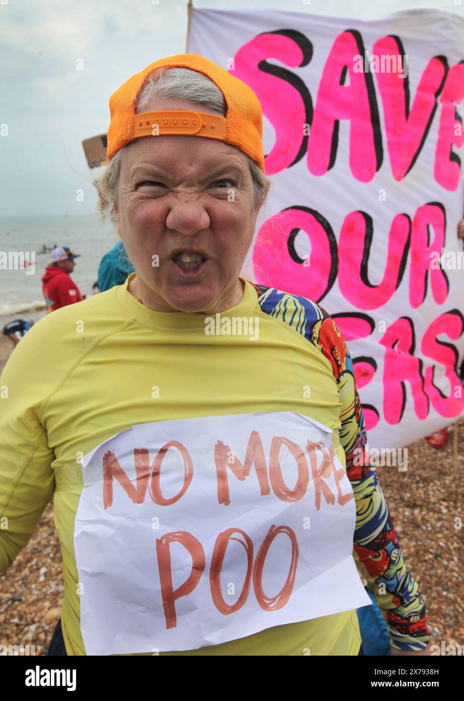 Brighton, England, UK. 18th May, 2024. A protester wears a sign saying ...