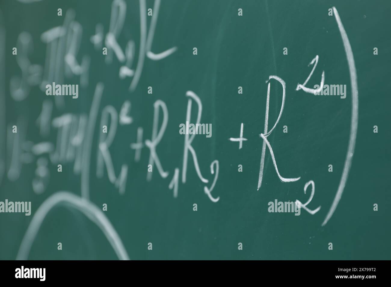 Different math formulas written with chalk on green board Stock Photo ...