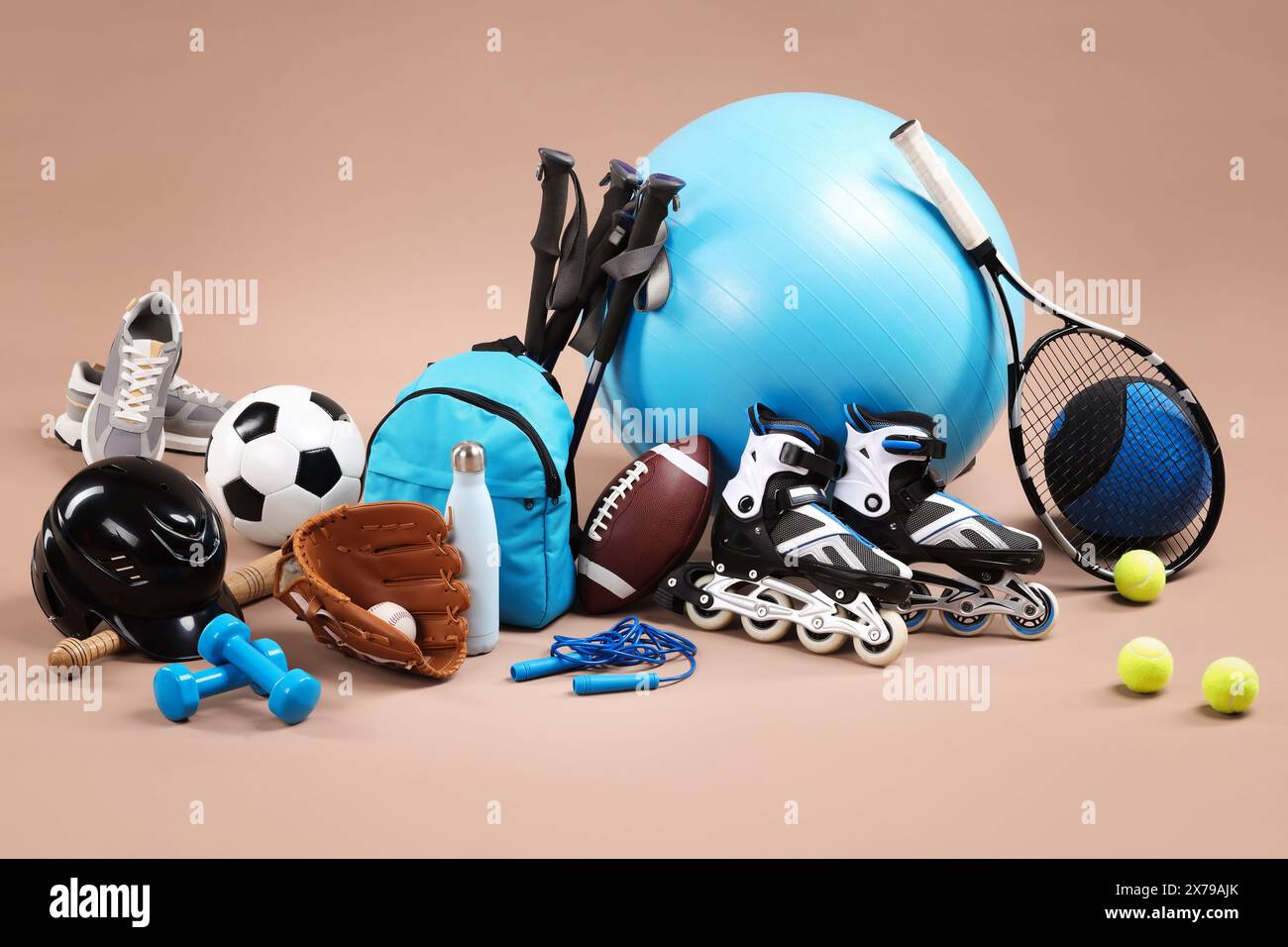 Many different sports equipment on beige background Stock Photo - Alamy