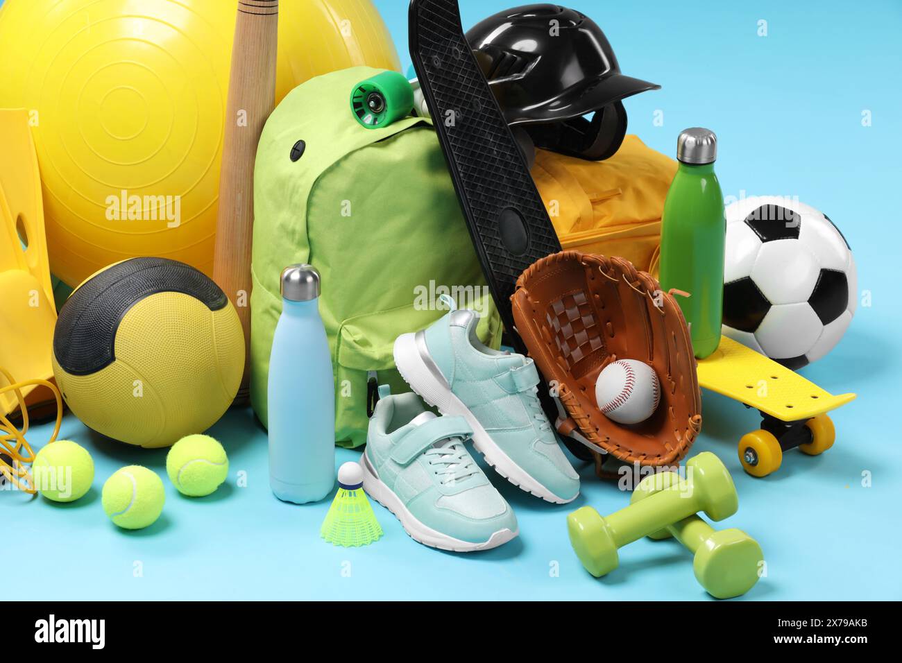 Many different sports equipment on light blue background, closeup Stock ...