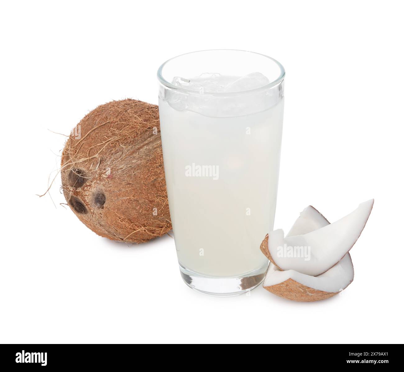 Glass of coconut water, ice cubes and nuts isolated on white Stock ...