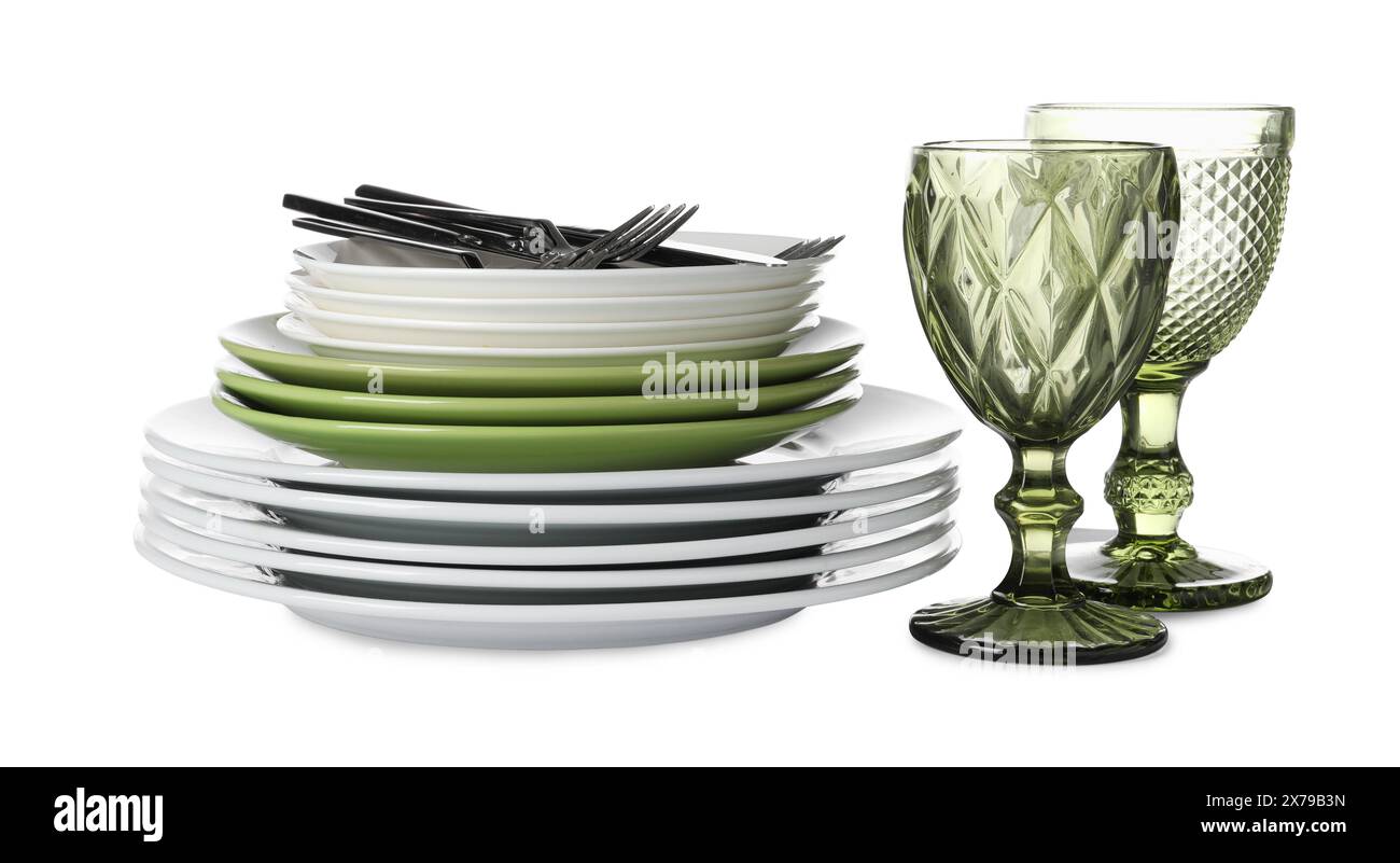 Set of beautiful ceramic dishware, glasses and cutlery isolated on ...