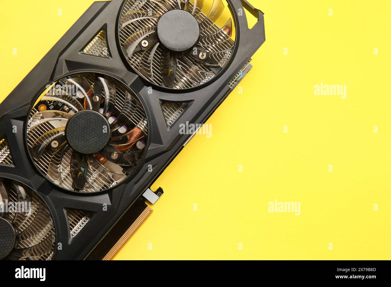 One graphics card on yellow background, top view. Space for text Stock ...