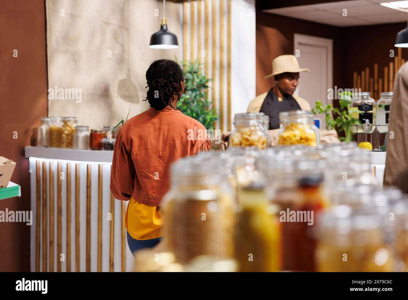 Image showing an African American female customer walking towards the ...