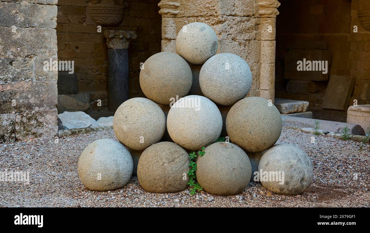 Stone pyramid made of cannonballs in an old fortress, outdoor area ...