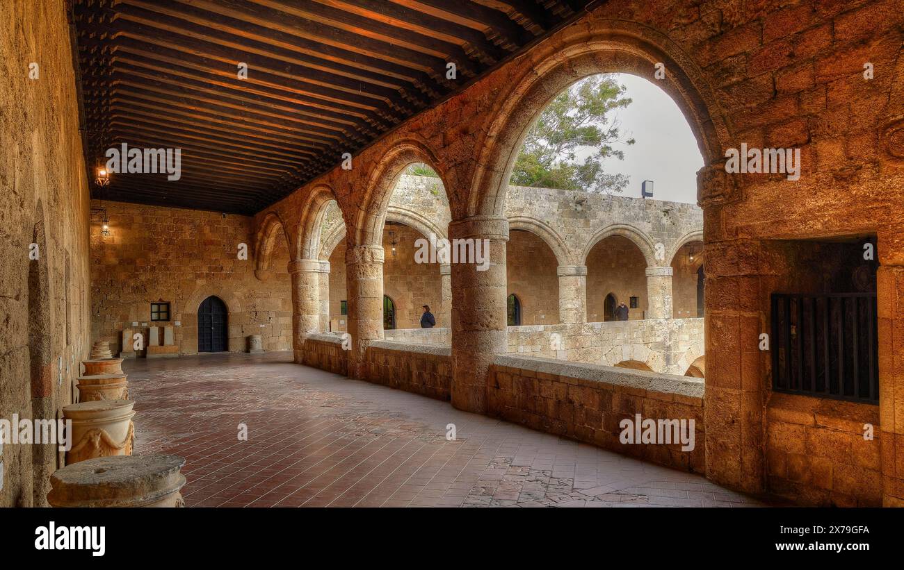 HDR image, Arcades of a stone monastery with medieval architecture ...