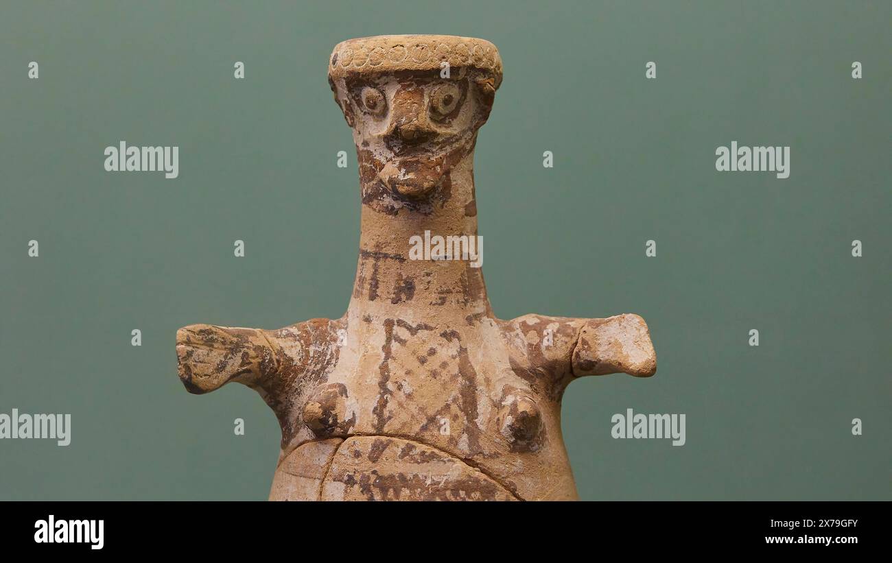 Ancient sculpture of a human-like body with green background, interiors ...