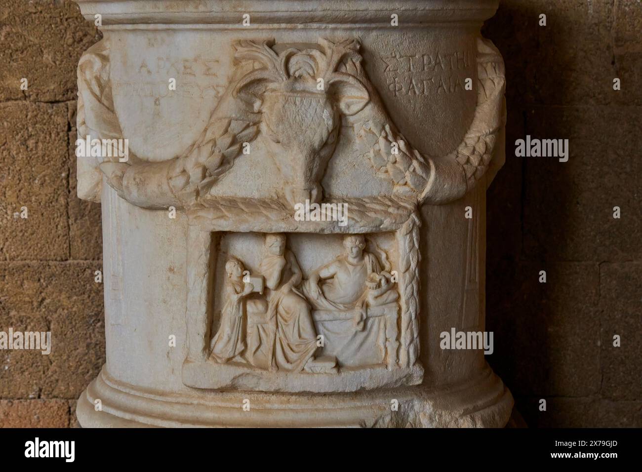 Ancient relief in a stonework with carved figures and a scene ...
