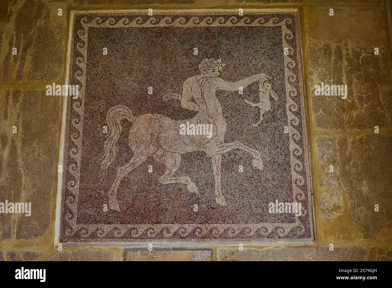 Antique mosaic with a centaur holding a rabbit, surrounded by ...