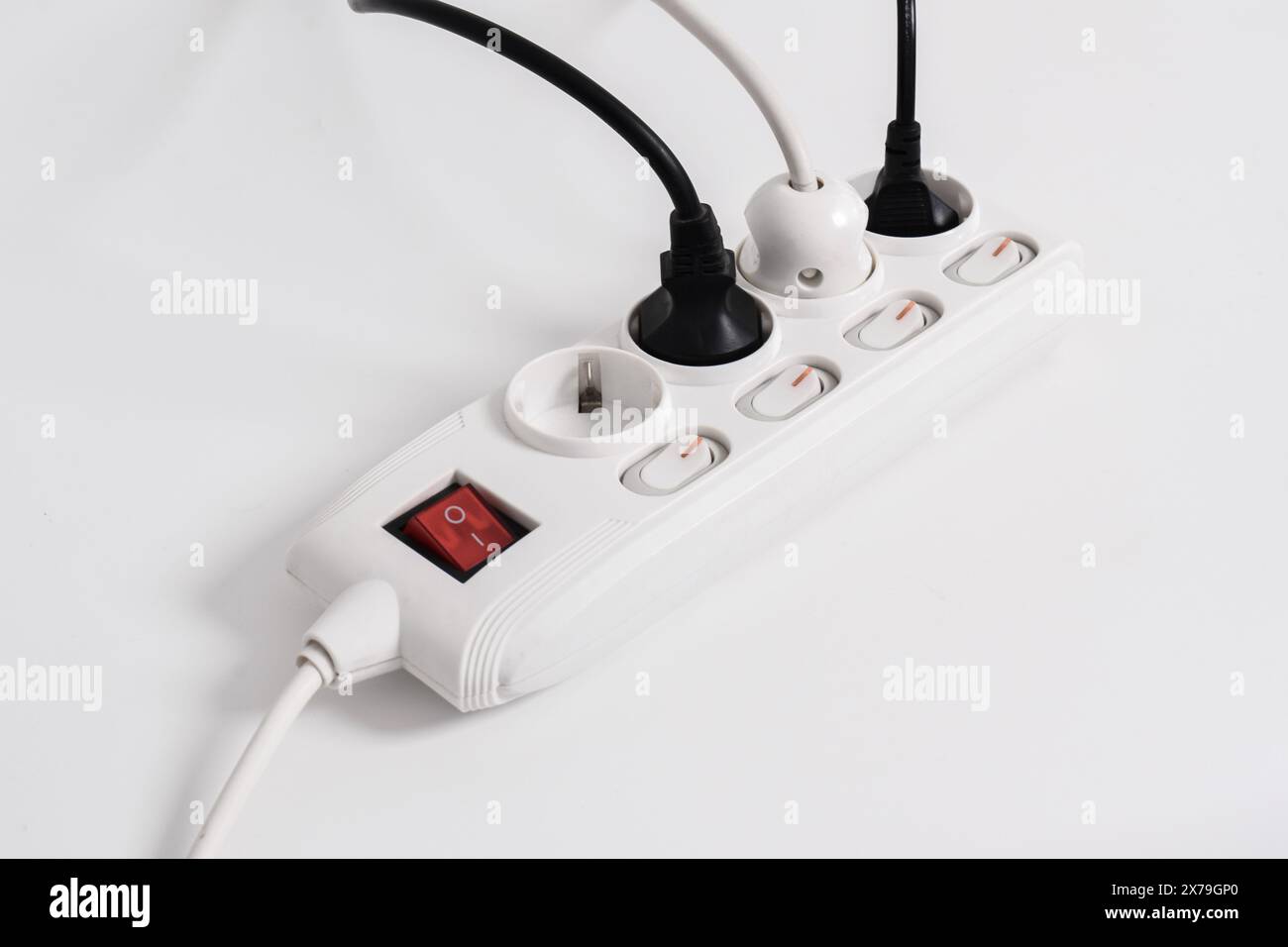 Electrical plug in outlet socket at home isolated on white background ...