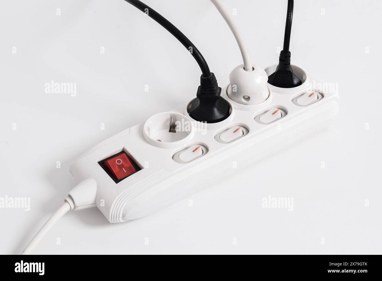 Electrical plug in outlet socket at home isolated on white background ...