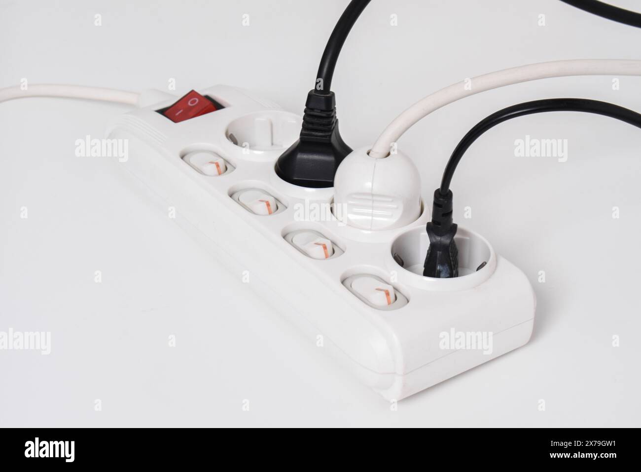 Electrical plug in outlet socket at home isolated on white background ...