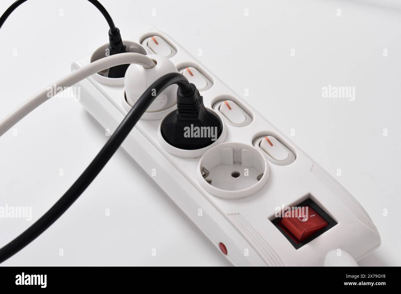 Electrical plug in outlet socket at home isolated on white background ...