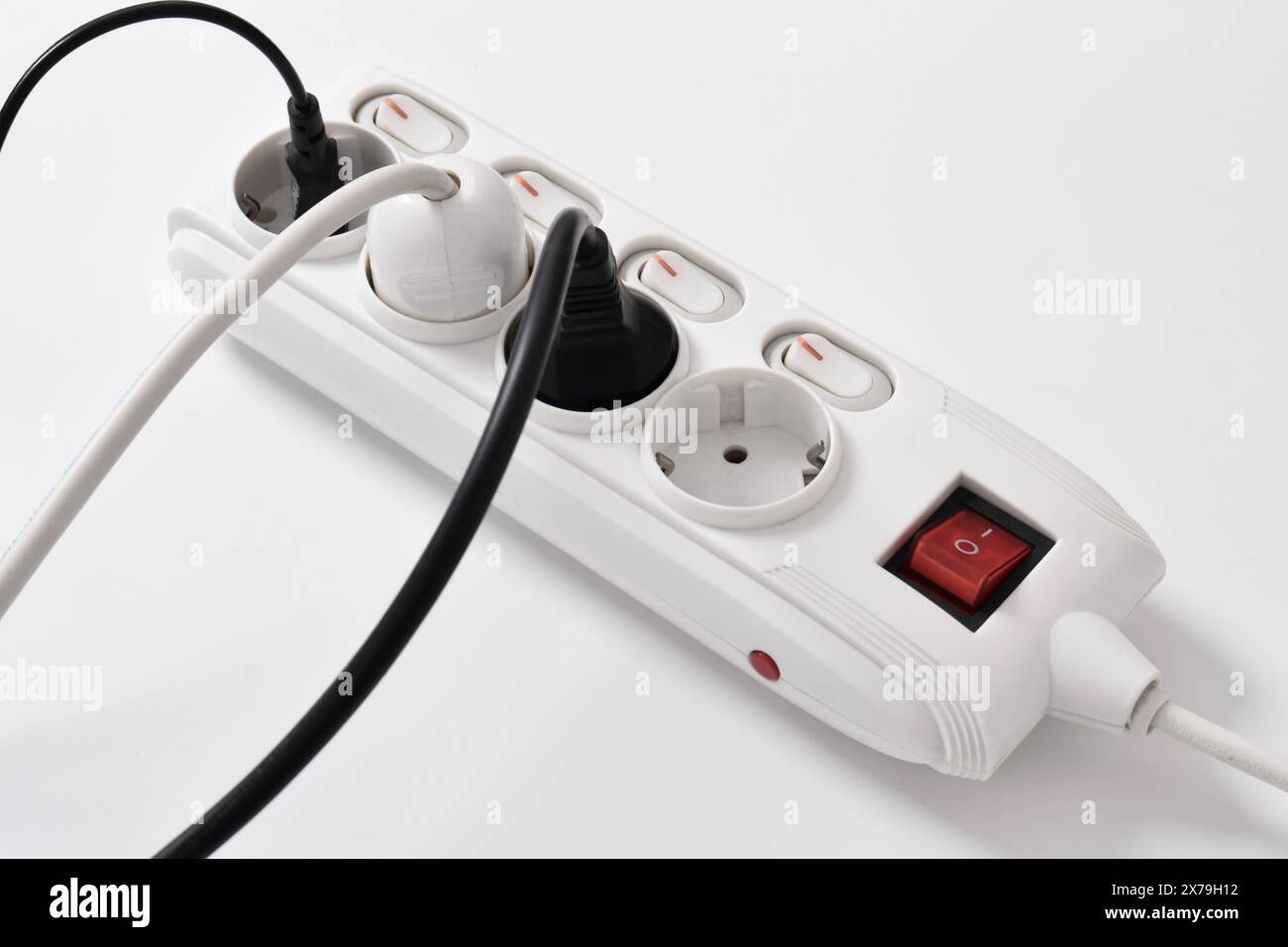 Electrical plug in outlet socket at home isolated on white background ...