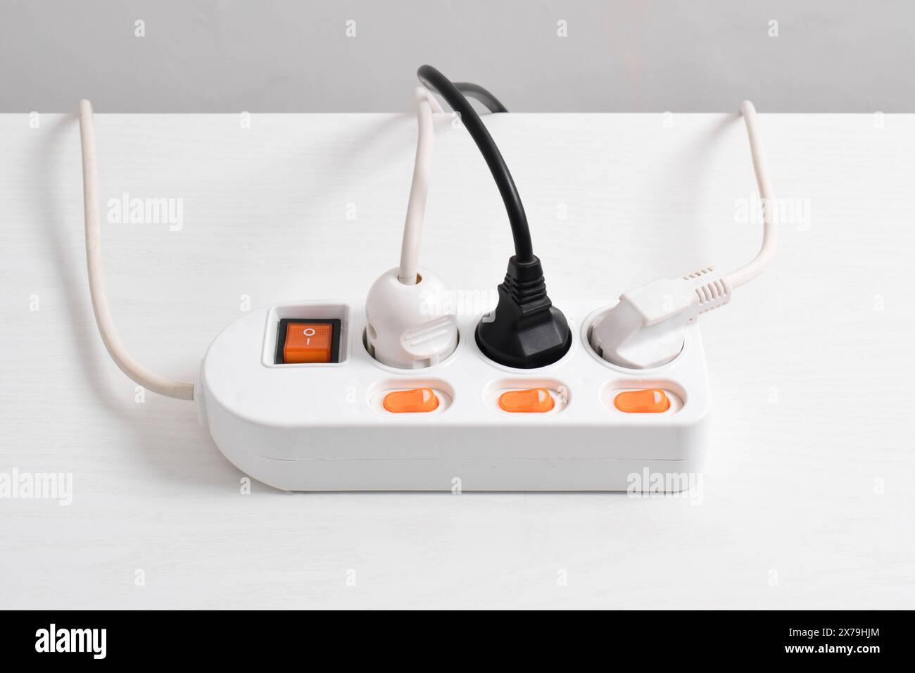 Electrical plug in outlet socket at home isolated on white background ...