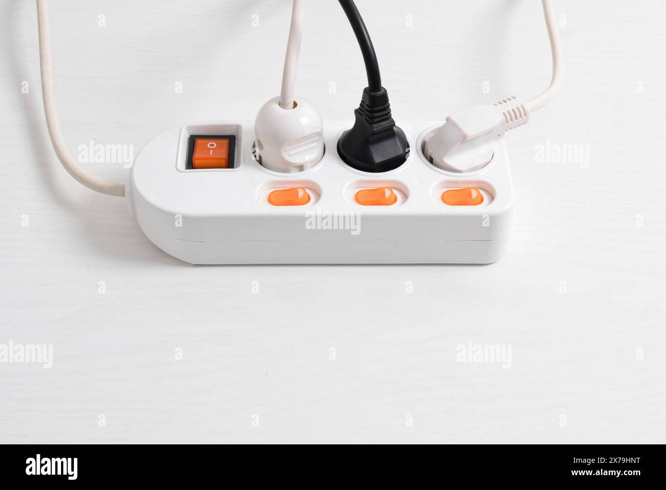 Electrical plug in outlet socket at home isolated on white background ...