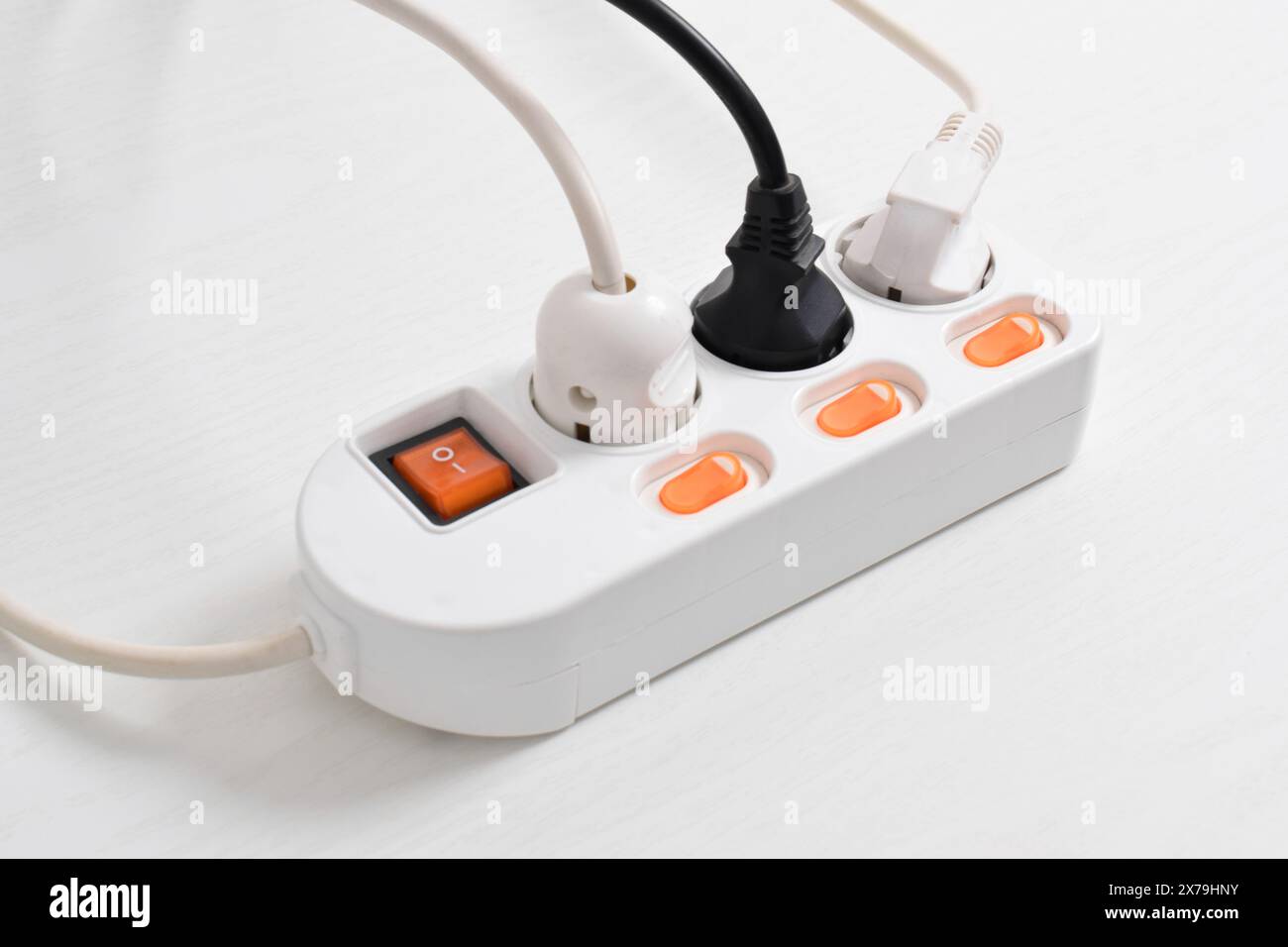 Electrical plug in outlet socket at home isolated on white background ...