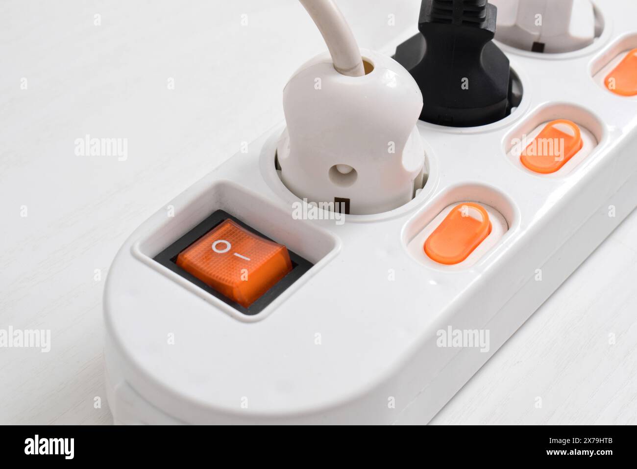 Electrical plug in outlet socket at home isolated on white background ...