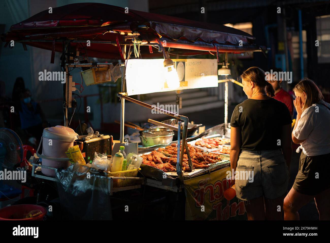 PHUKET, THAILAND - APRIL 25, 2023: street vendor of snack foods as seen ...