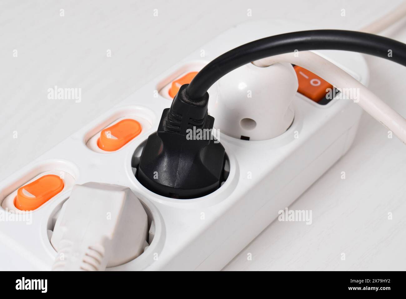 Electrical plug in outlet socket at home isolated on white background ...
