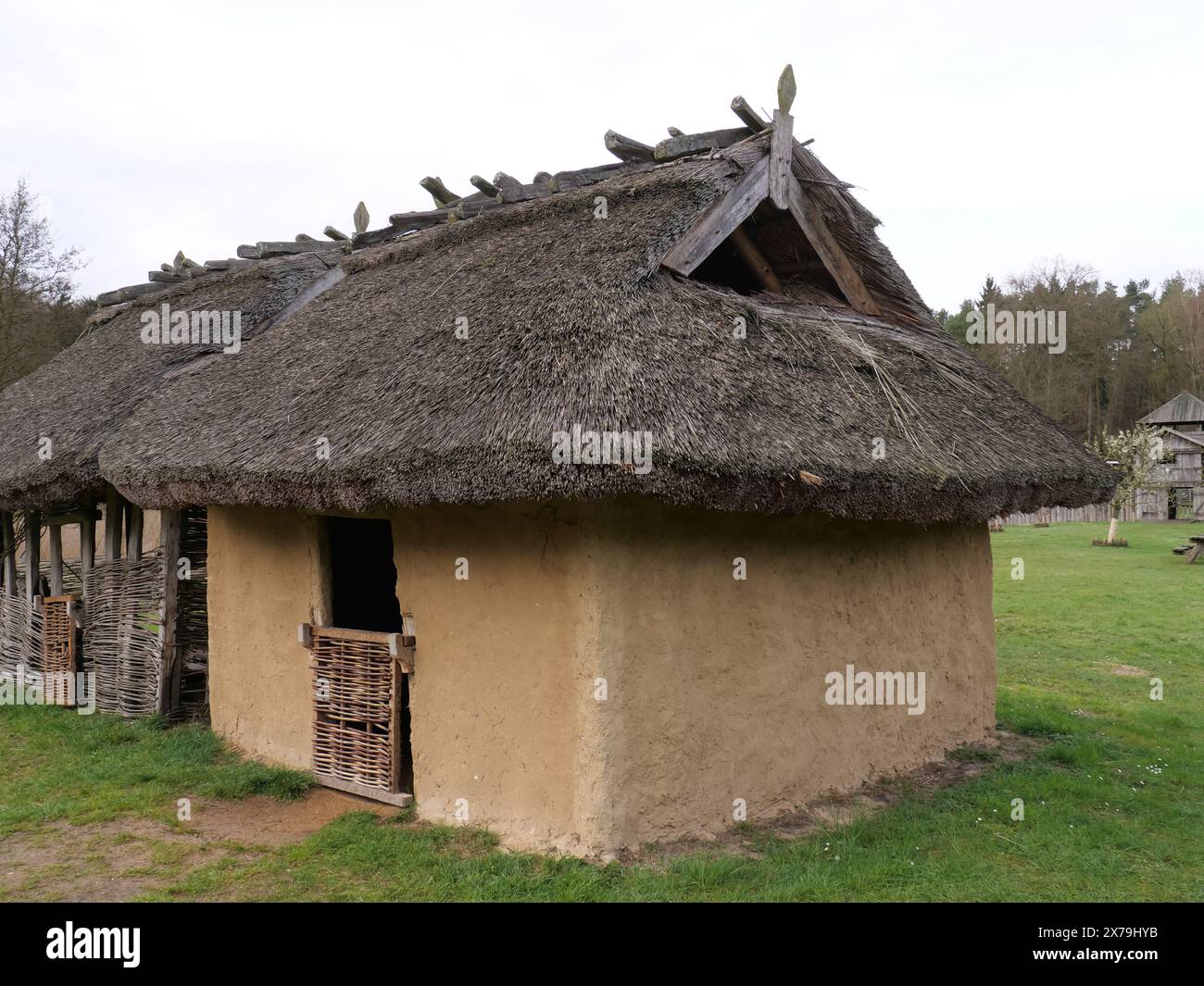 Slavic house covered with thatch in an open-air museum Stock Photo - Alamy