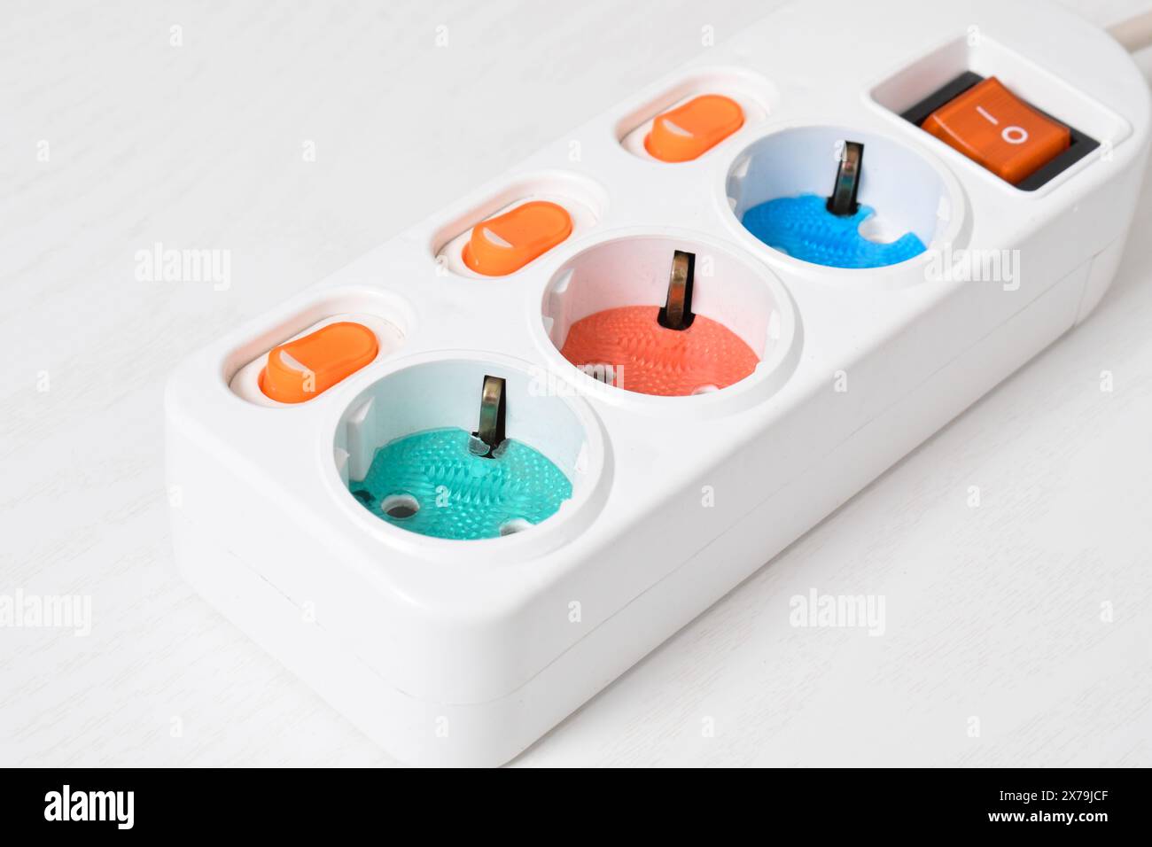 White Electrical plug in outlet socket at home isolated on white ...