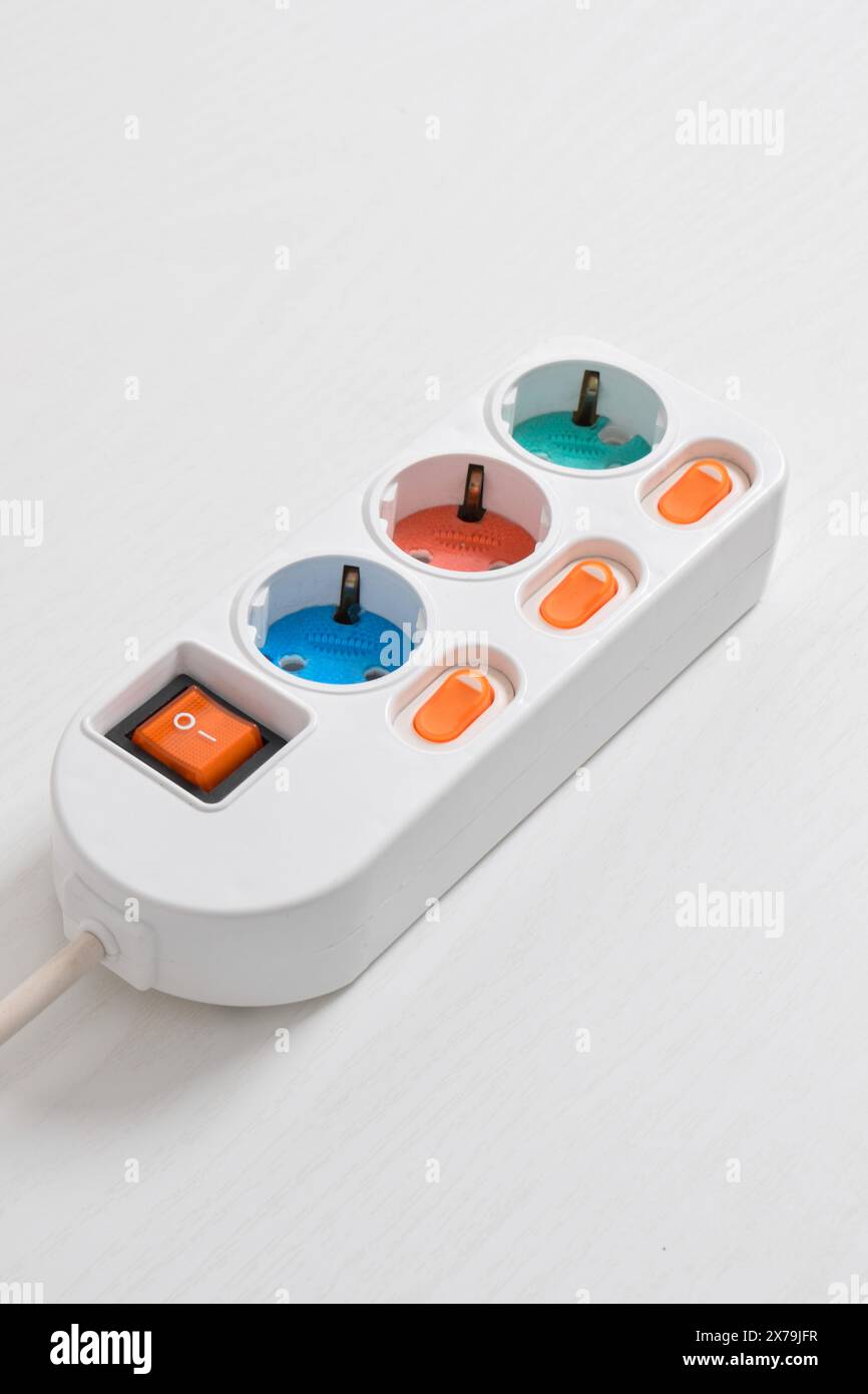 White Electrical plug in outlet socket at home isolated on white ...