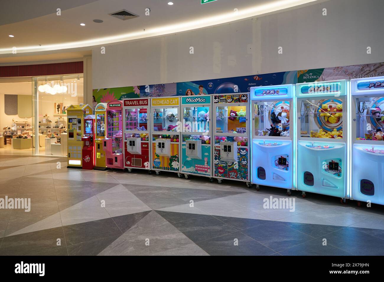 PHUKET, THAILAND - APRIL 30, 2023: a row of claw machines as seen ...