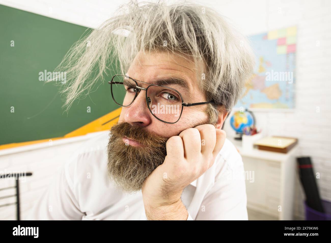 Closeup portrait of serious teacher in glasses at university. Male ...