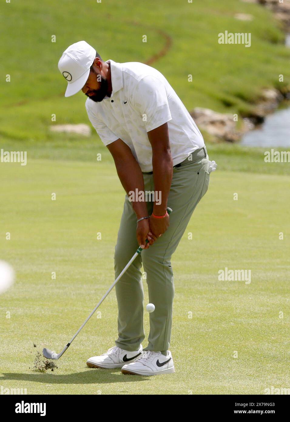 Tony Finau chips on to the seventh green during the third round of the ...