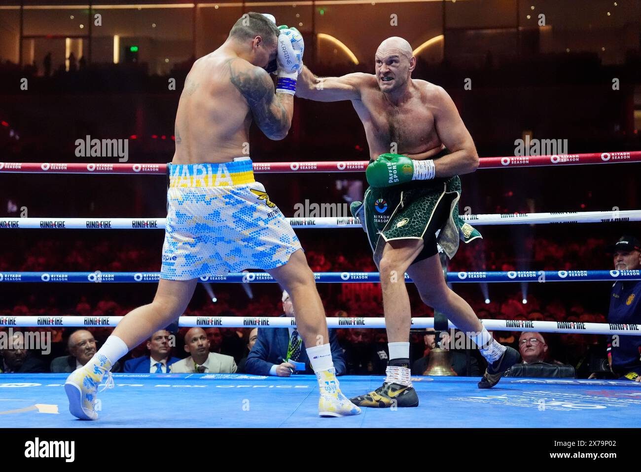 Tyson Fury (right) lands a punch against Oleksandr Usyk during the ...