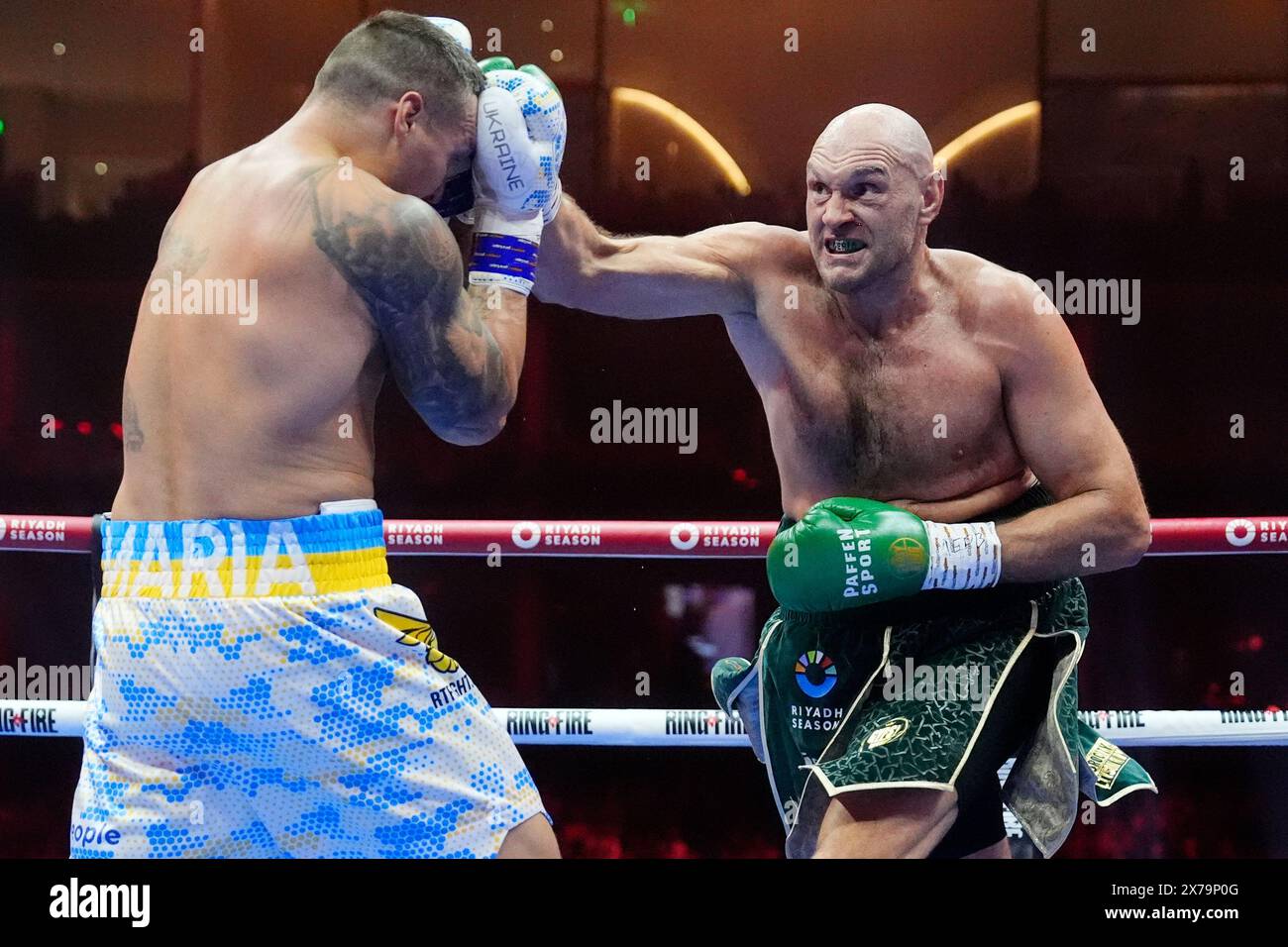 Tyson Fury (right) lands a punch against Oleksandr Usyk during the ...