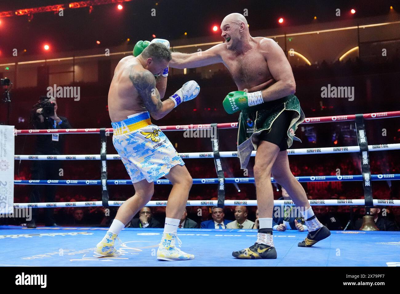 Tyson Fury (right) lands a punch against Oleksandr Usyk during the ...