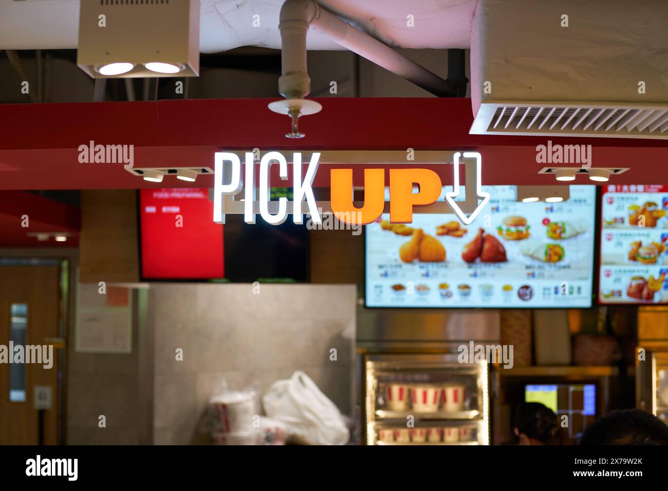 HONG KONG, CHINA - DECEMBER 05, 2023: pick up sign as seen inside KFC ...