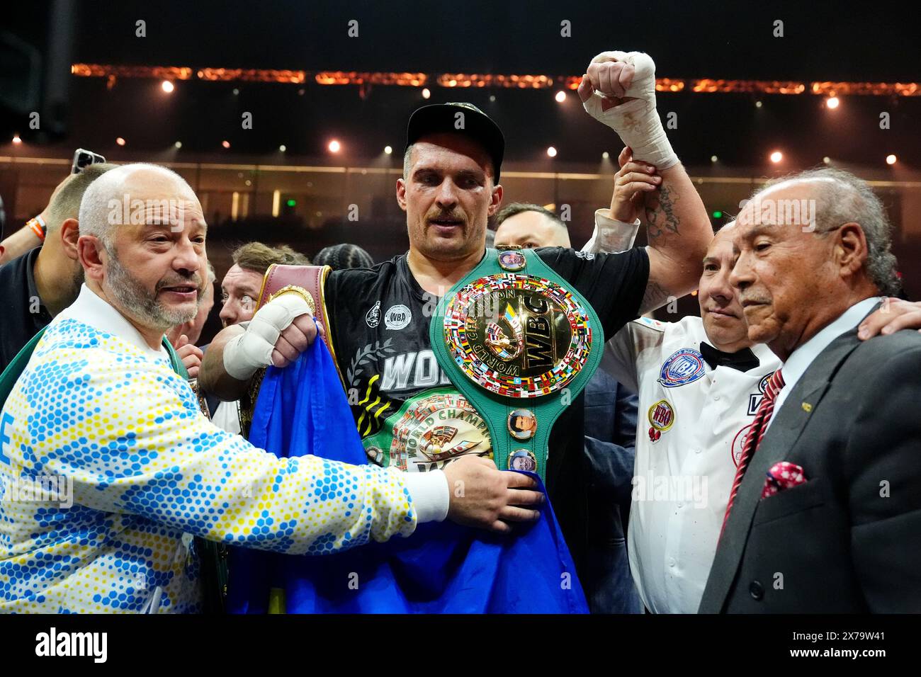 Oleksandr Usyk celebrates with the Undisputed Heavyweight title belt ...