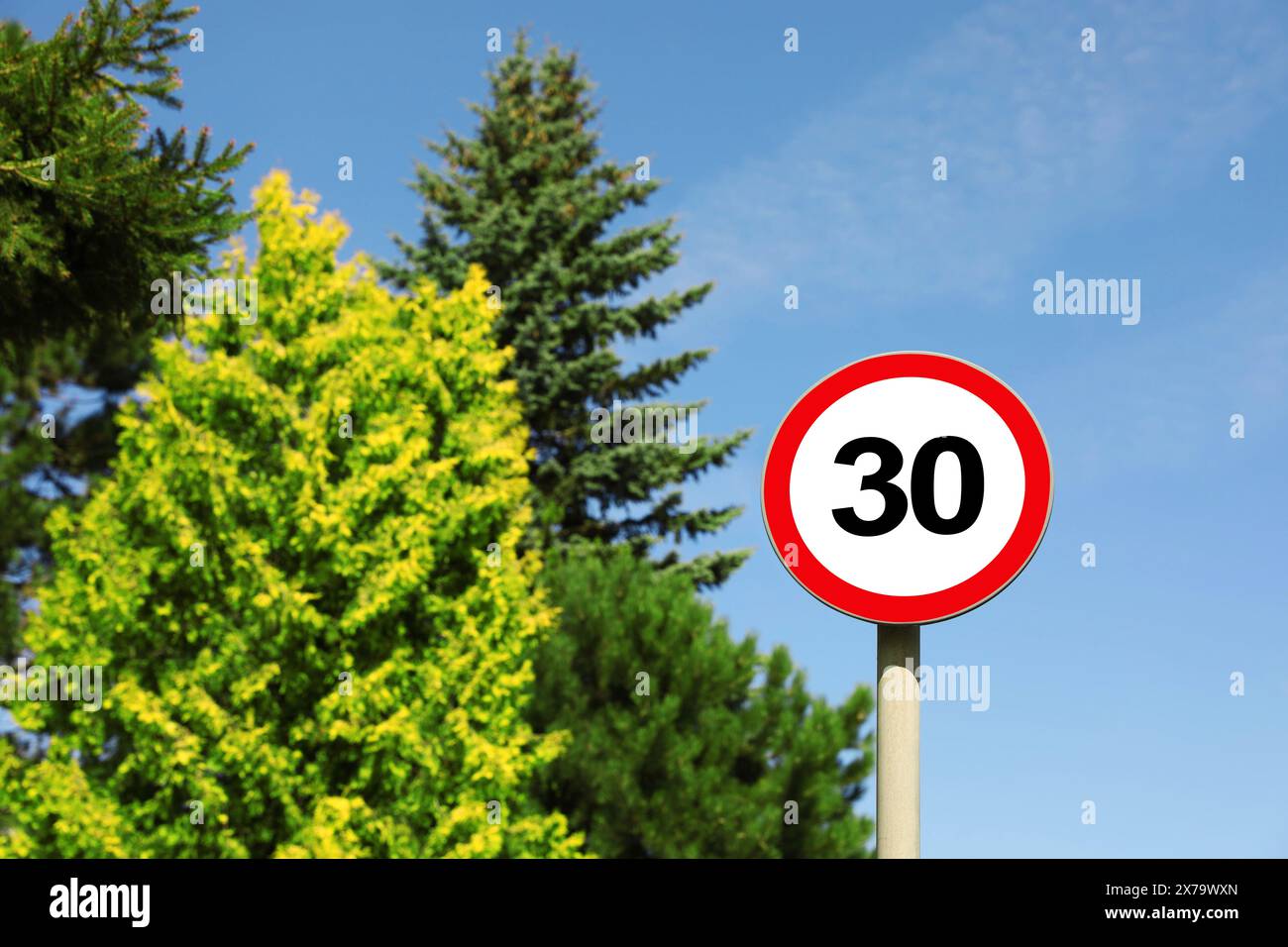 Road sign Maximum speed limit against blue sky Stock Photo - Alamy