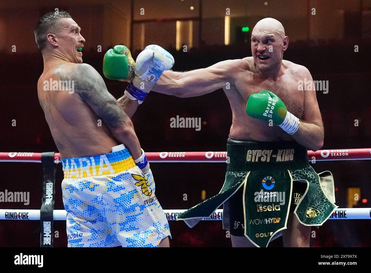 Tyson Fury (right) lands a punch against Oleksandr Usyk during the ...