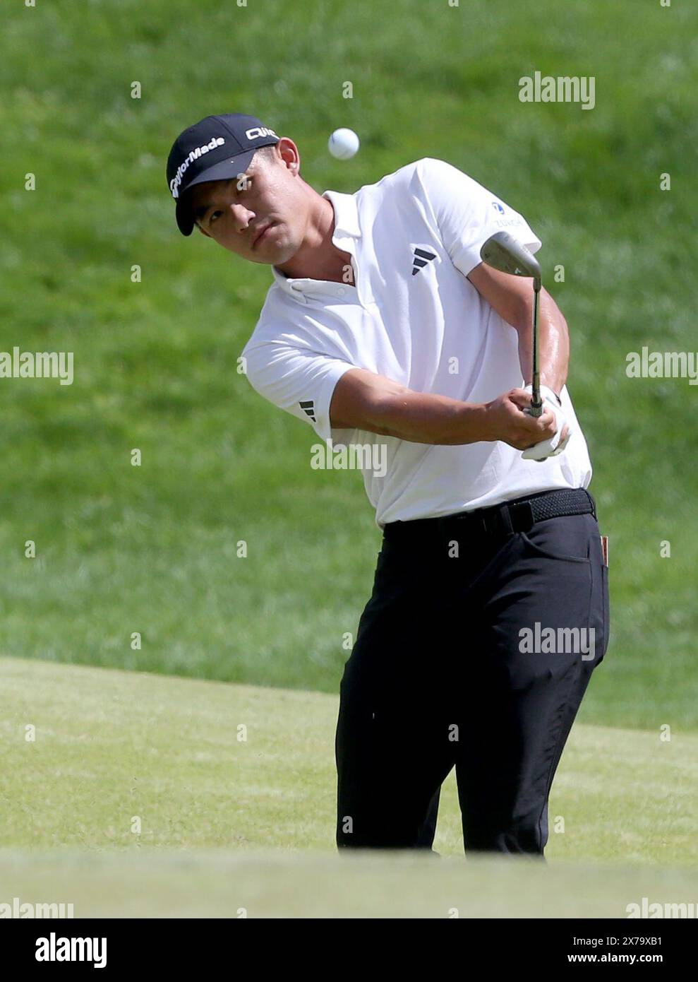 Collin Morikawa chips onto the seven green during the third round of ...