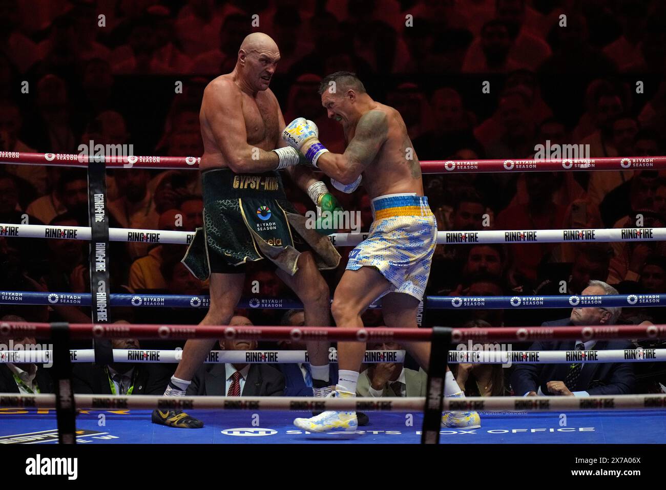 Britain's Tyson Fury, left, and Ukraine's Oleksandr Usyk trade blows ...