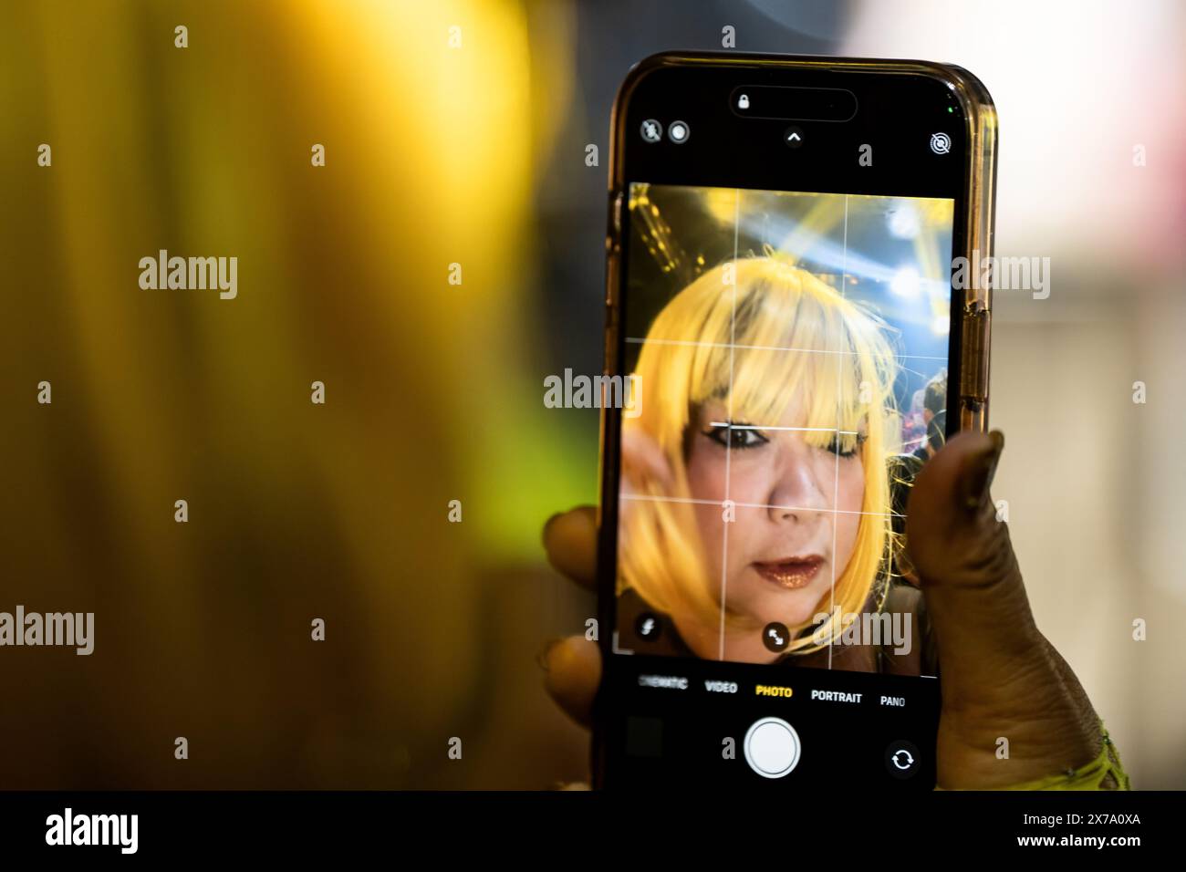 Thailand. 18th May, 2024. A fan dressed in banana-themed attire takes a ...