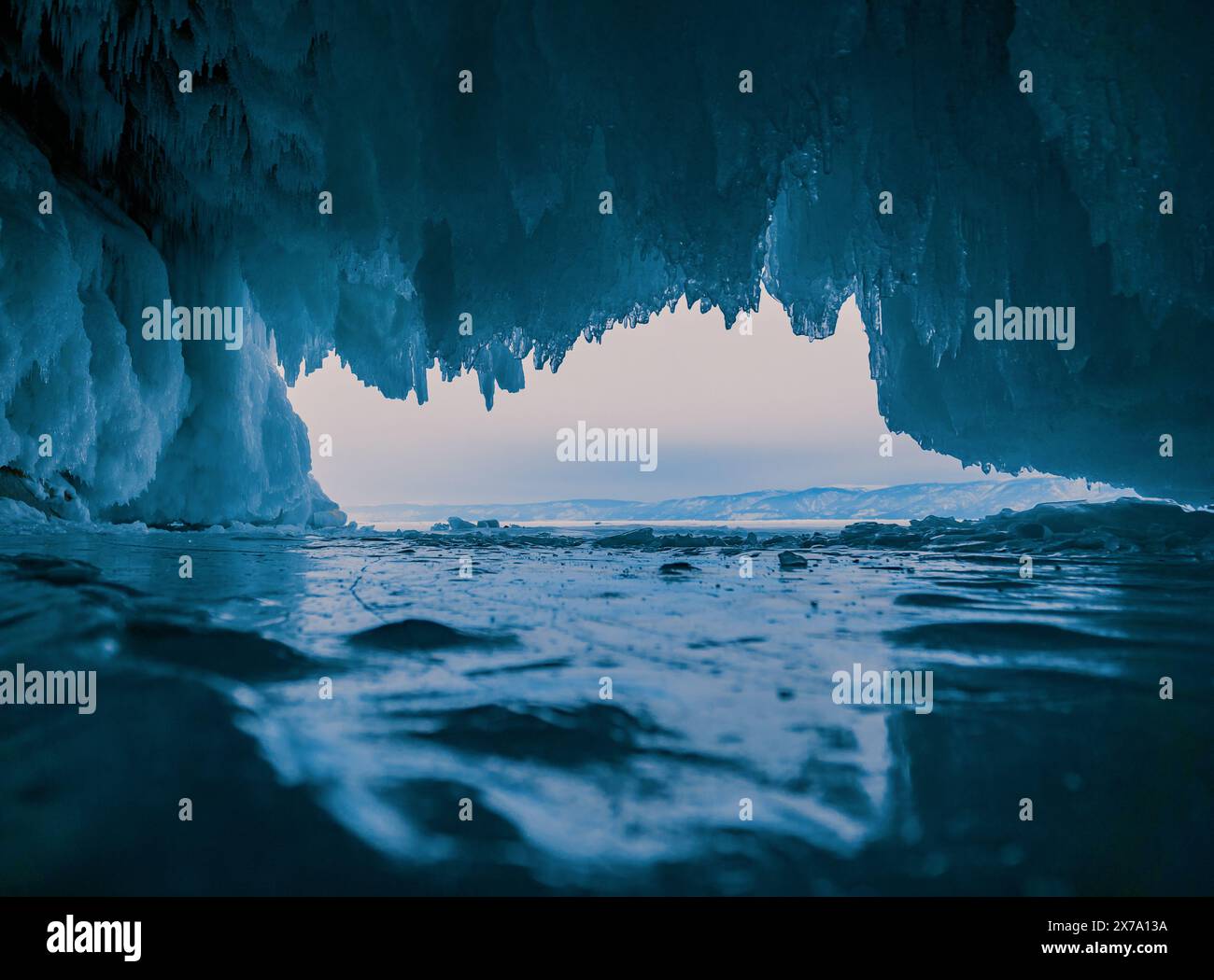 Inside a stunning ice cave on Lake Baikal, large icicles hang from the ...