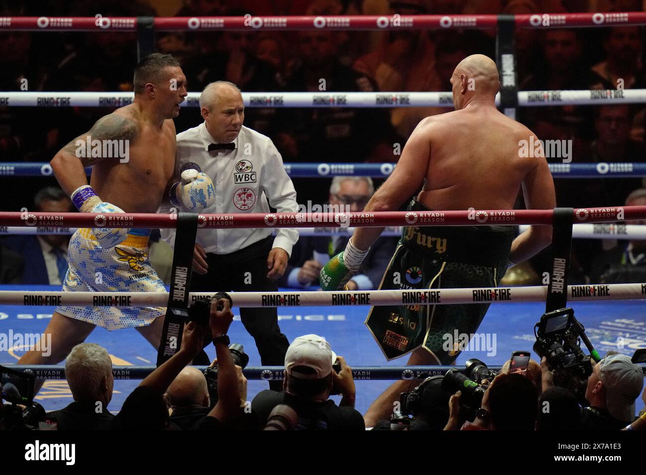 Ukraine's Oleksandr Usyk, left, pursues Britain's Tyson Fury during ...
