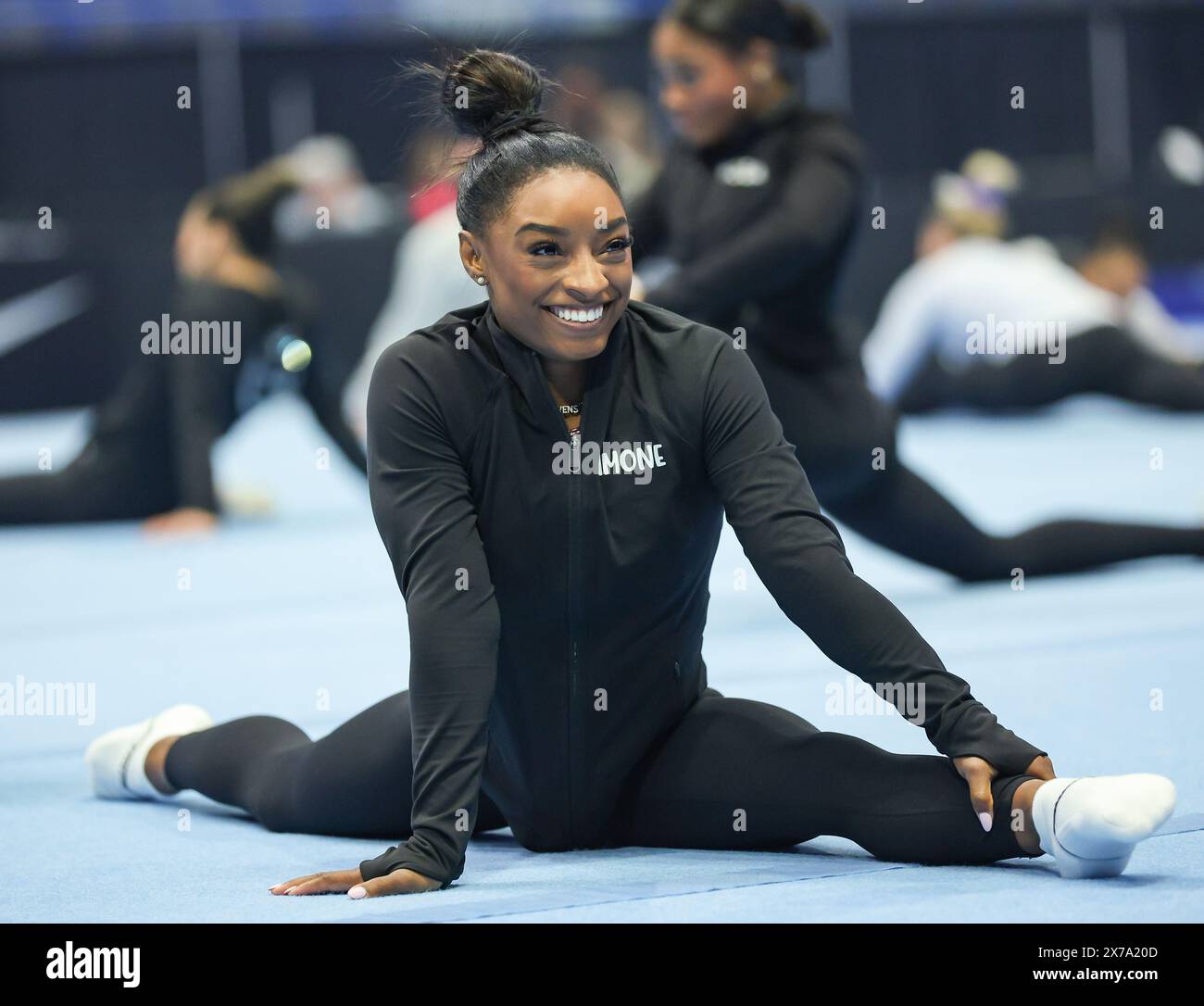Hartford, CT, USA. 18th May, 2024. Simone Biles smiles as she stretches ...