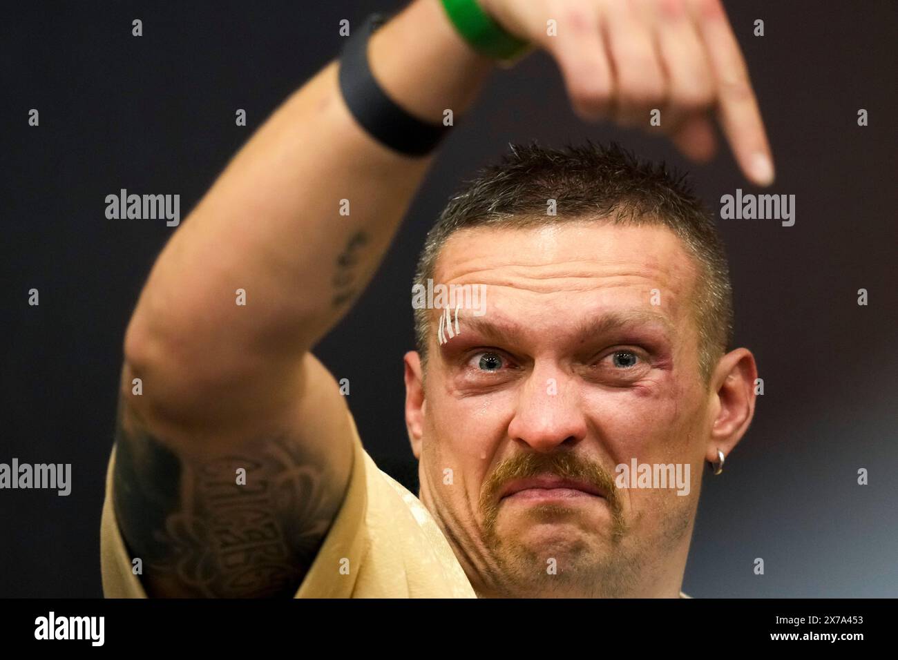 Ukraine's Oleksandr Usyk gestures as he talks about his father during a ...