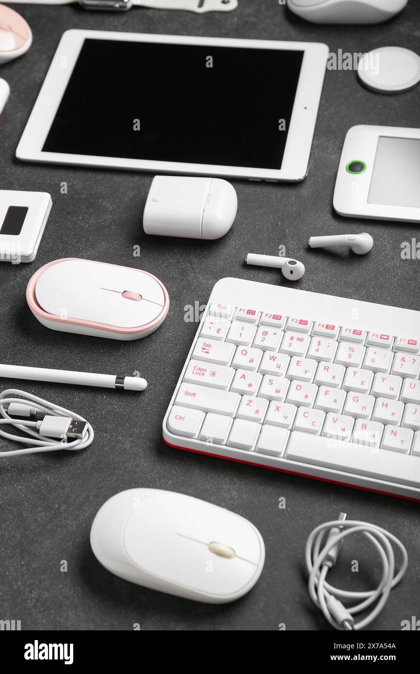 Composition with different modern devices on dark background Stock ...