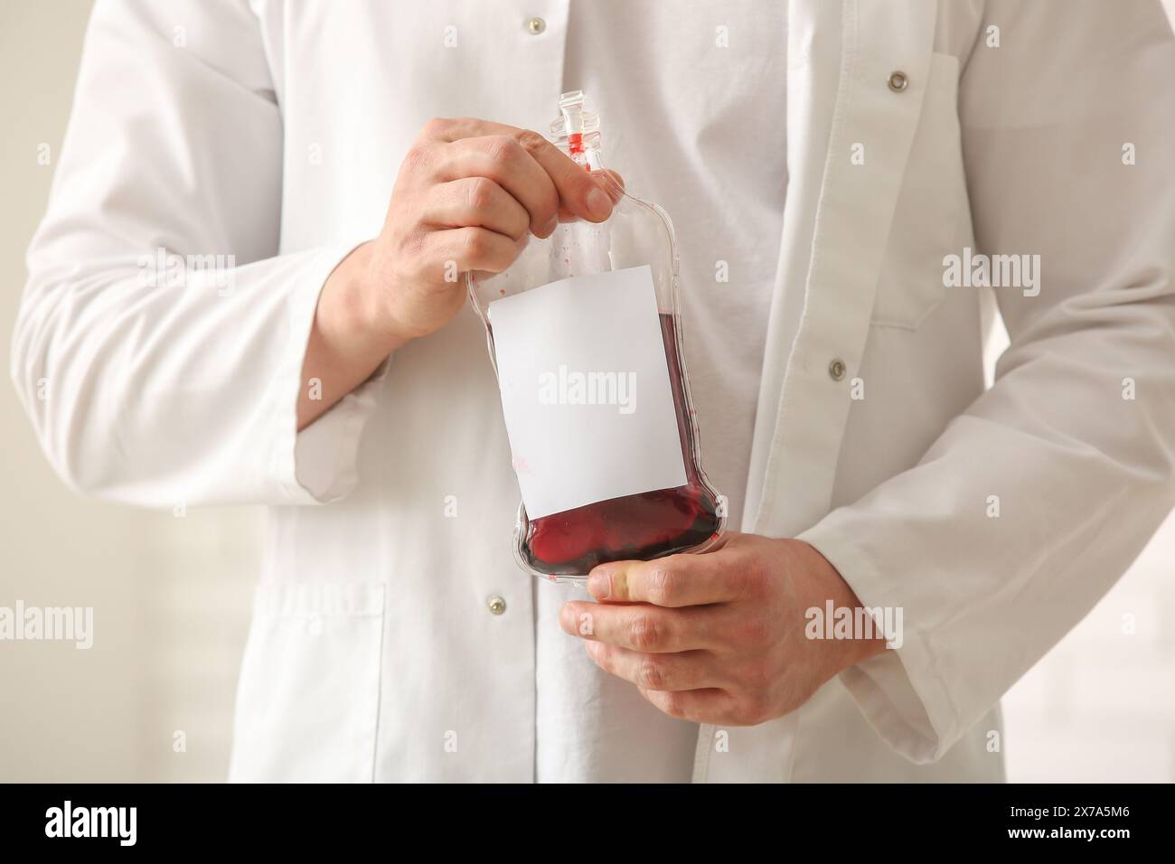 Doctor with blood pack in clinic. Blood donation concept Stock Photo ...